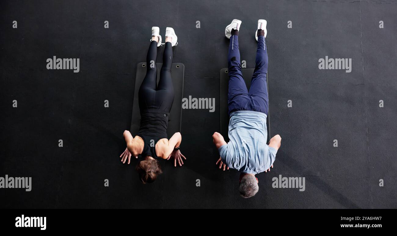 Active Couple Doing Pilates Workout In Gym Stock Photo - Alamy