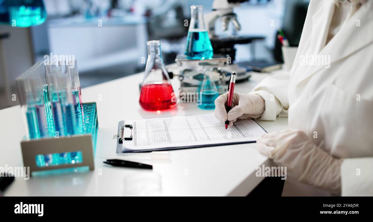 Lab doctor writing clinical data hi-res stock photography and images ...