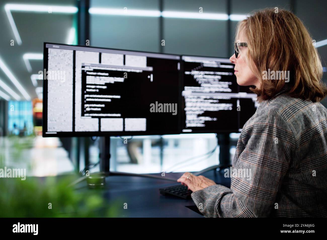 Woman coding on computers hi-res stock photography and images - Alamy