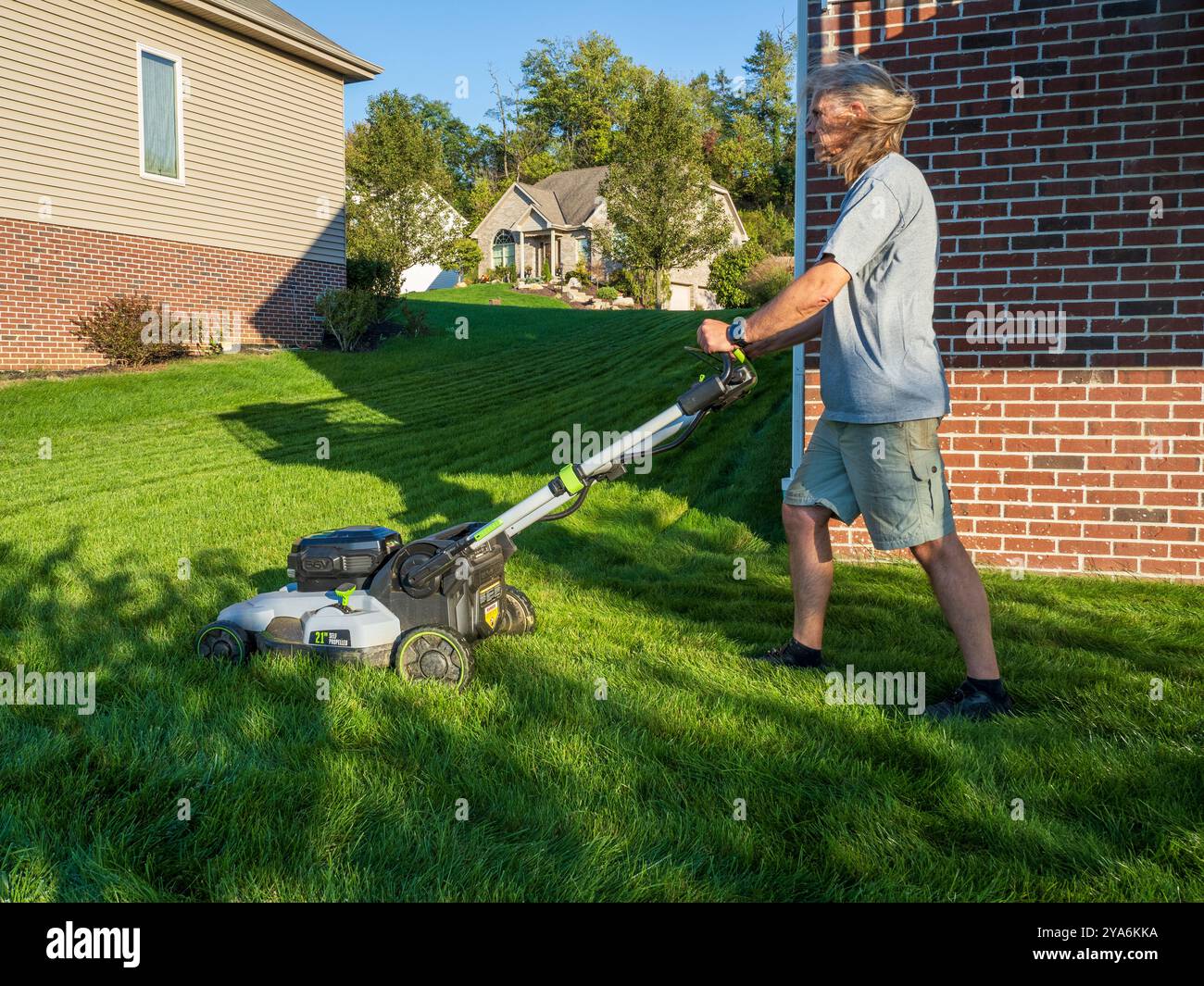 Person using electric lawn hi-res stock photography and images - Alamy