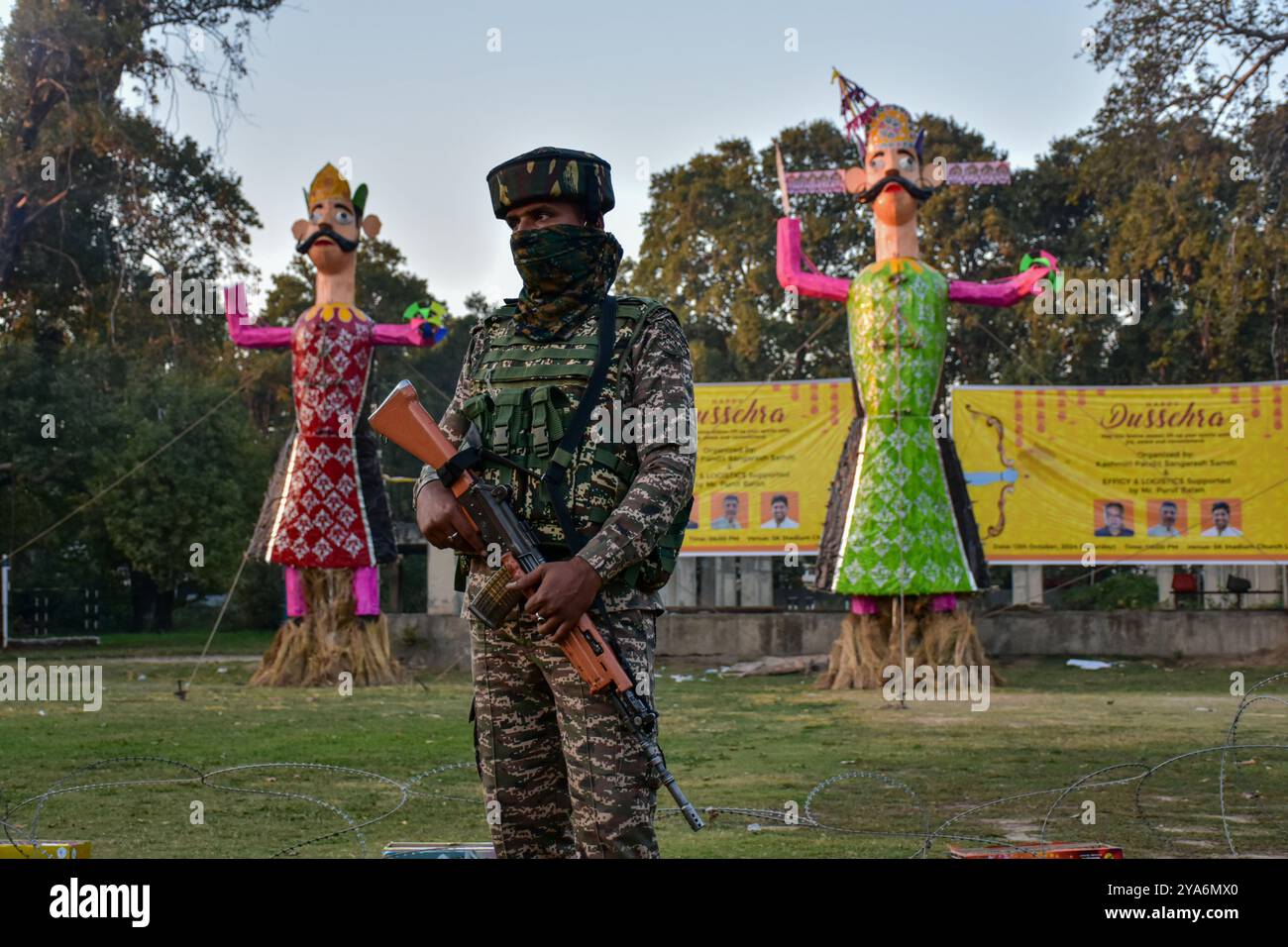 A paramilitary trooper stands on guard in front of an effigy of demon ...