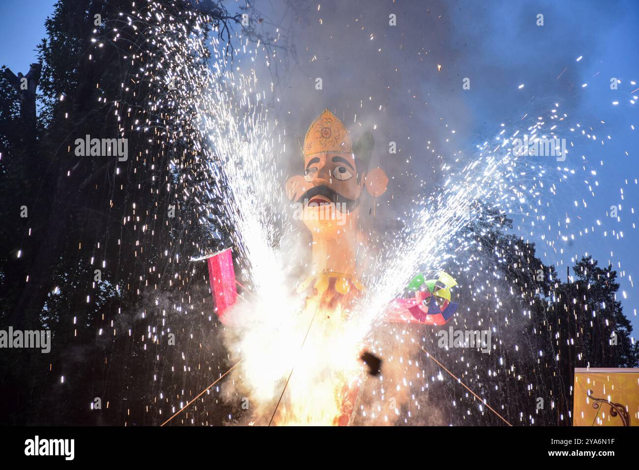 An effigy of demon king Ravana goes up in flames during the Dussehra ...