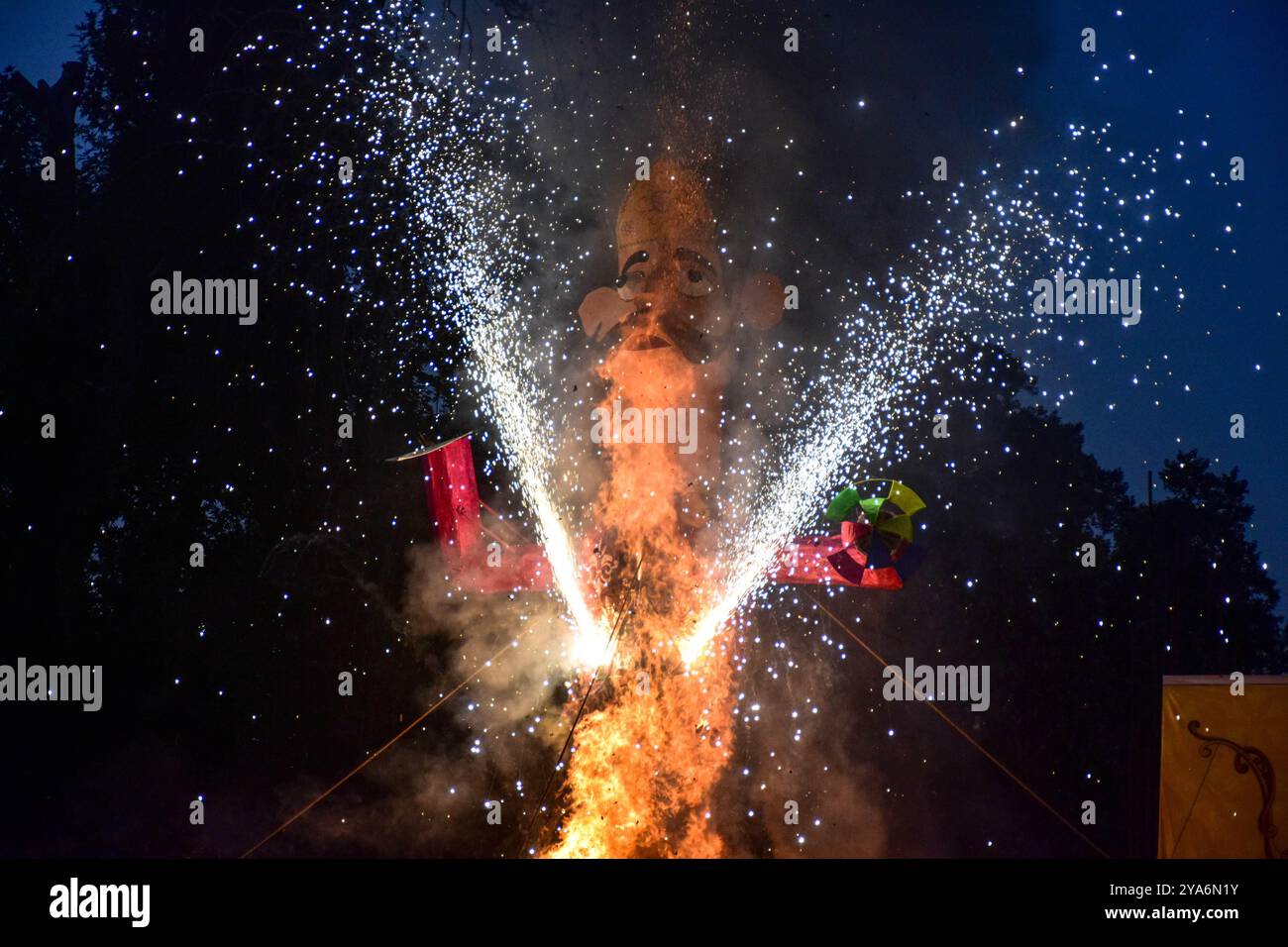 An effigy of demon king Ravana goes up in flames during the Dussehra ...