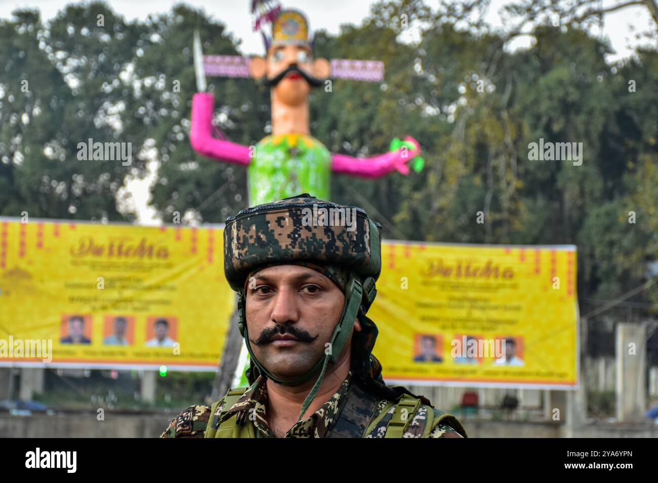 Srinagar, India. 12th Oct, 2024. A paramilitary trooper stands looks on ...