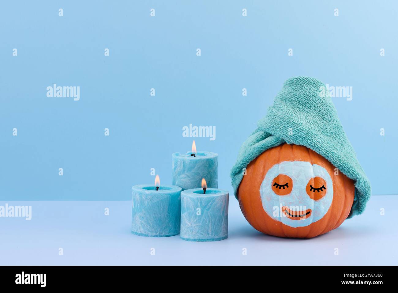 Pumpkin Spa Day. A pumpkin with a towel and face mask Stock Photo - Alamy