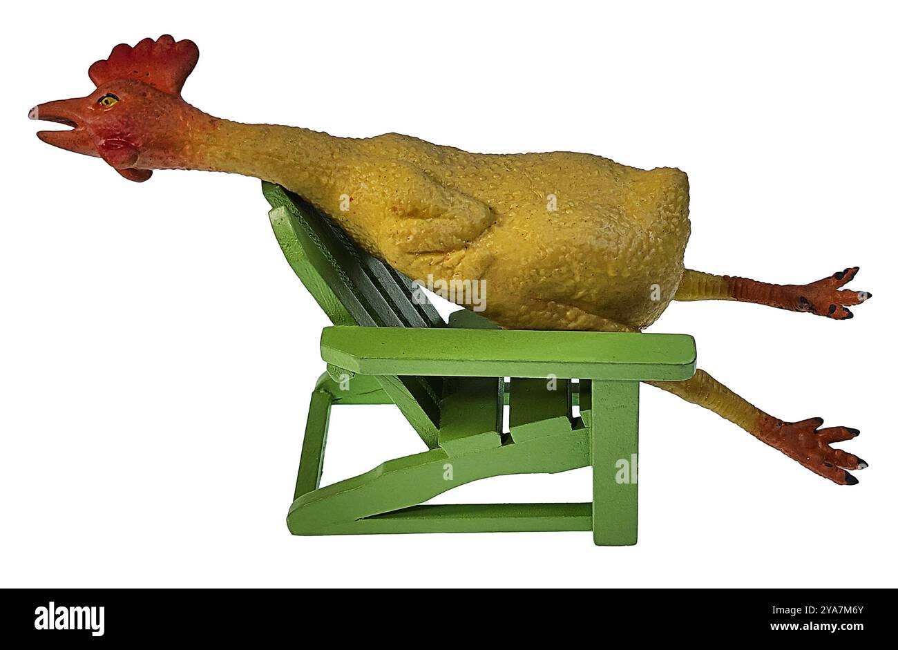 Rubber chicken laying on a lounge chair Stock Photo - Alamy