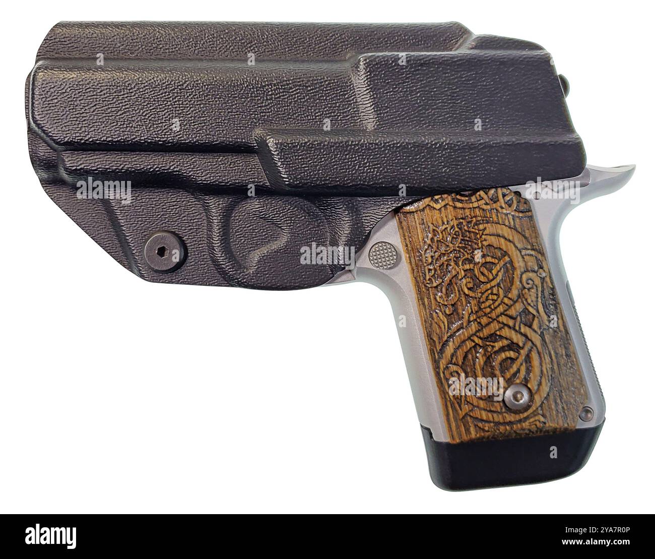 Silver metal gun with Celtic Engraved grip Stock Photo - Alamy