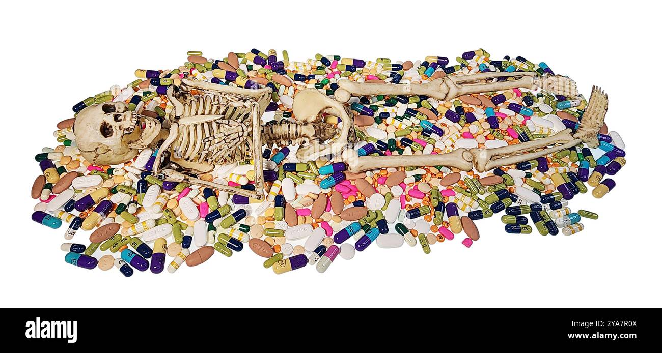 A Skeleton showing the different bones of the body laying on a pile of ...