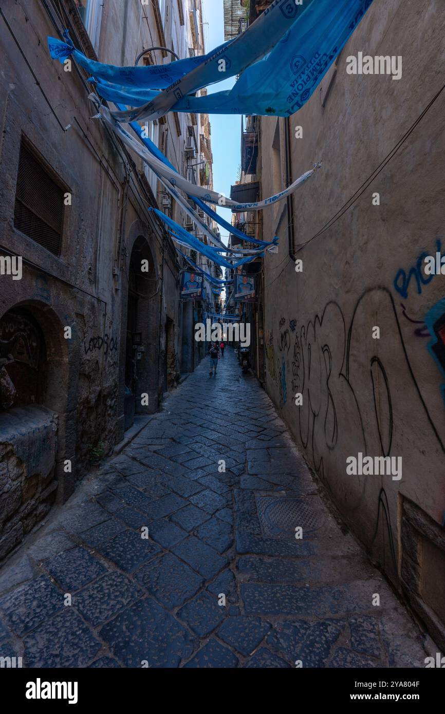 Naples, Italy - May 23, 2024: Dim Alley in Naples Adorned with Blue and ...