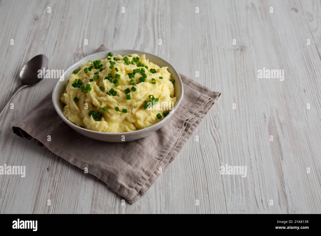 Homemade Chive and Garlic Mashed Potatoes in a Bowl, side view Stock ...