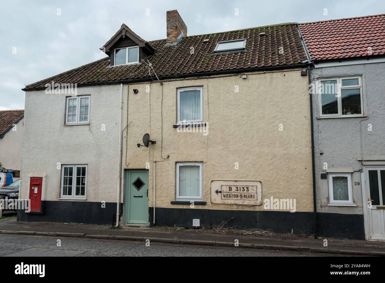 October 2024 - Older terraced homes with old road sign and vintage ...