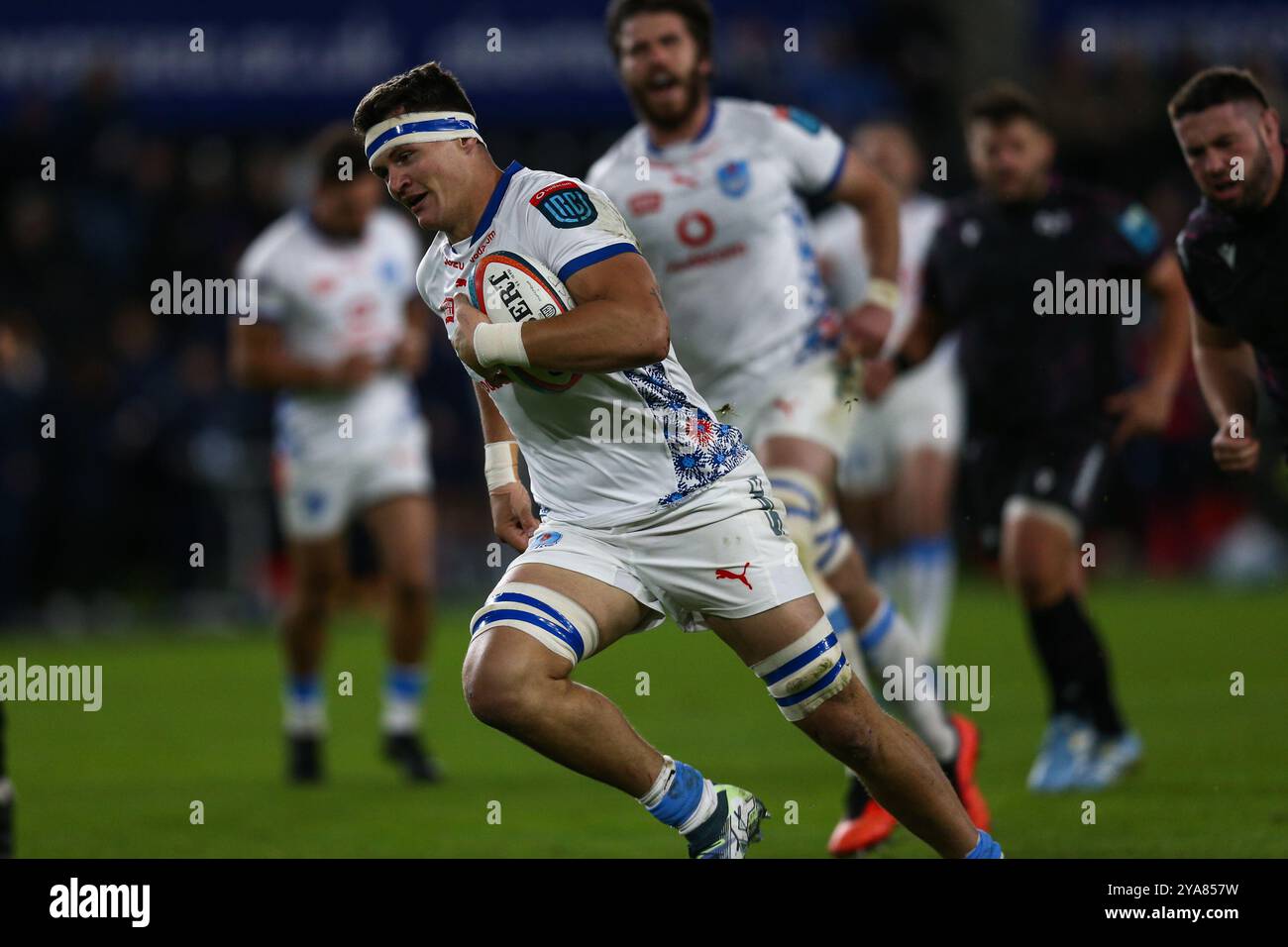 Swansea, UK. 12 October, 2024. Elrigh Louw of Vodacom Bulls runs in to ...