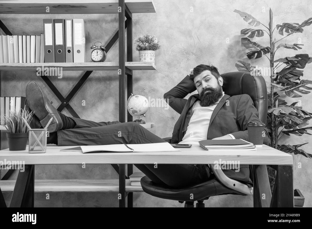 Tired guy in suit relaxing from work with legs on office desk, rest ...