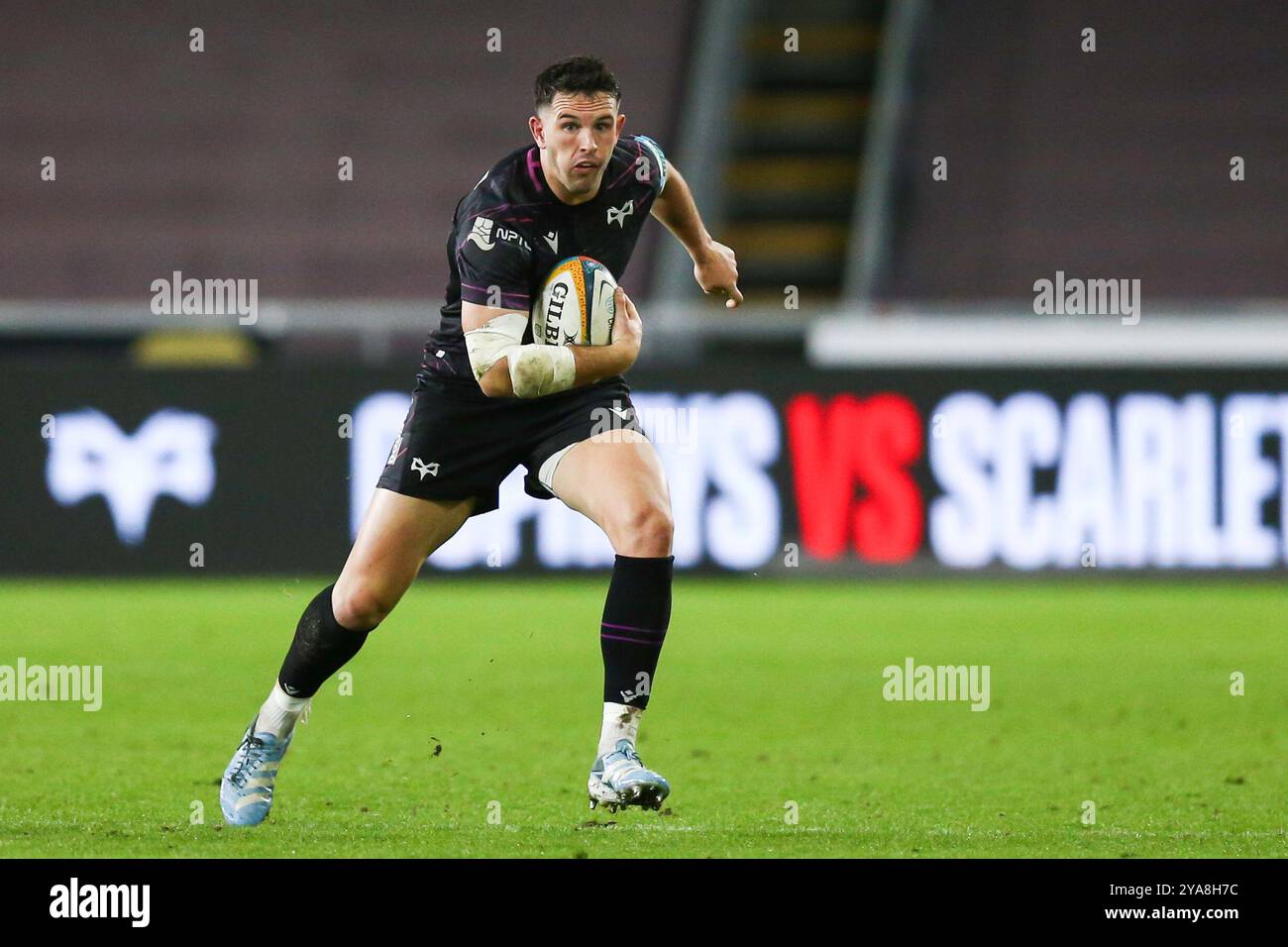 Swansea, UK. 12 October, 2024. Owen Watkin of Ospreys looks for a gap ...
