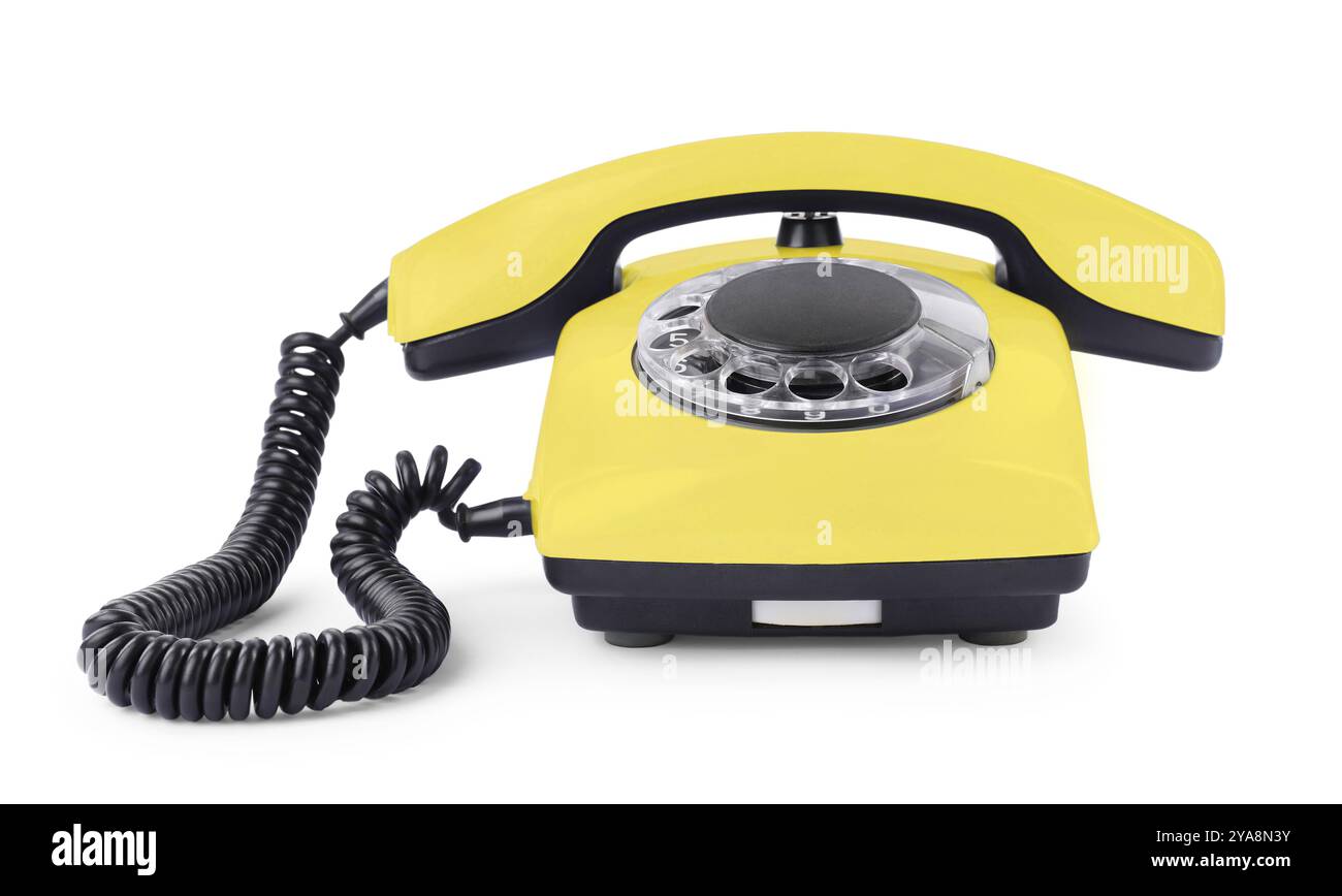 Old yellow telephone with rotary dial isolated on white Stock Photo - Alamy