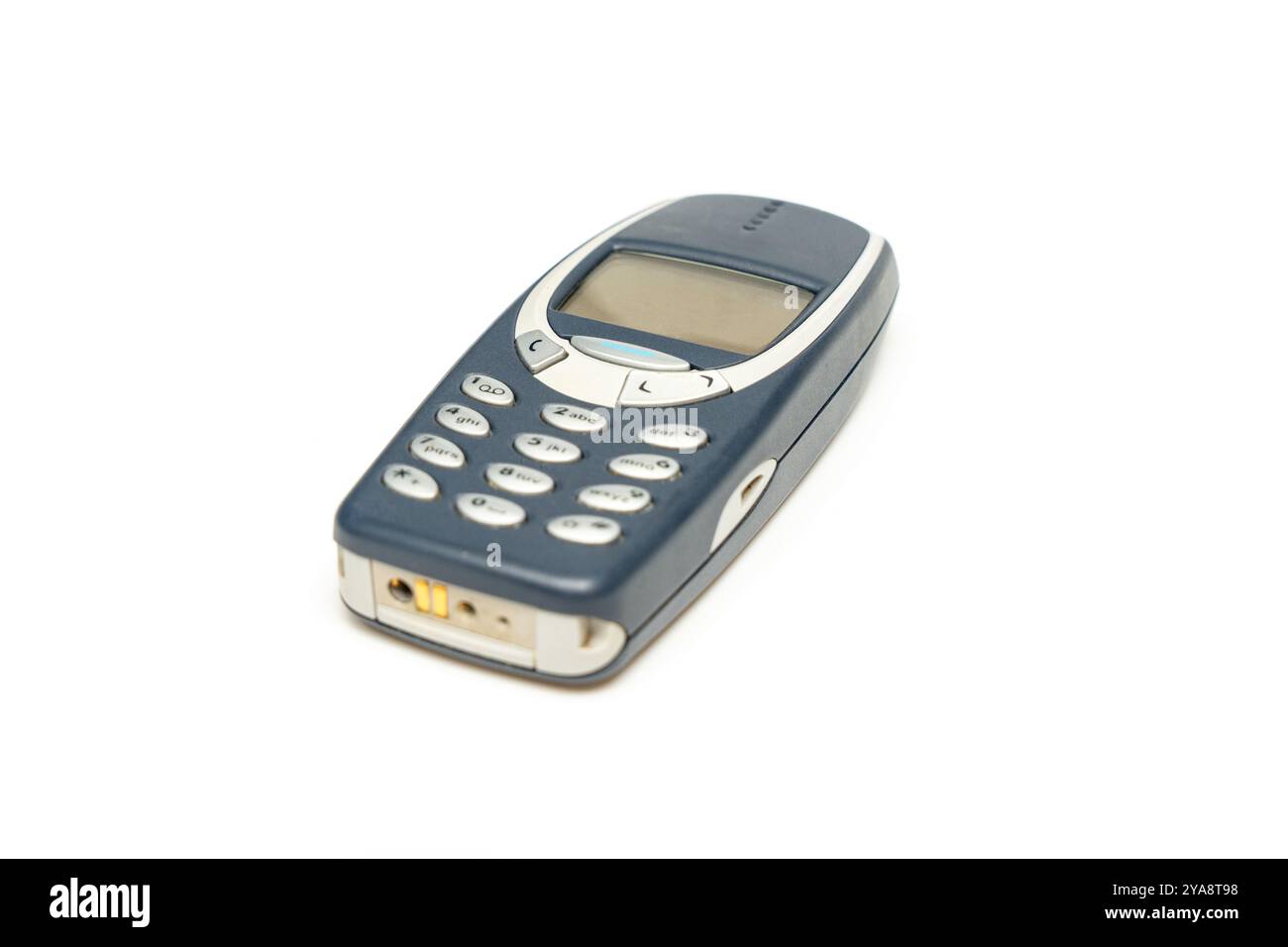 Old dark push-button mobile phone isolated on white background. Mobile ...