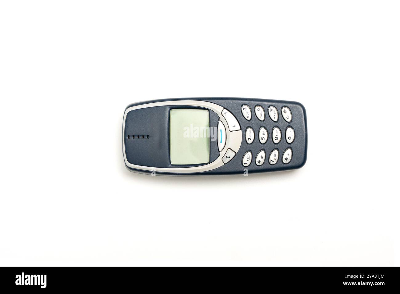 Old push-button mobile phone with green screen isolated on white ...