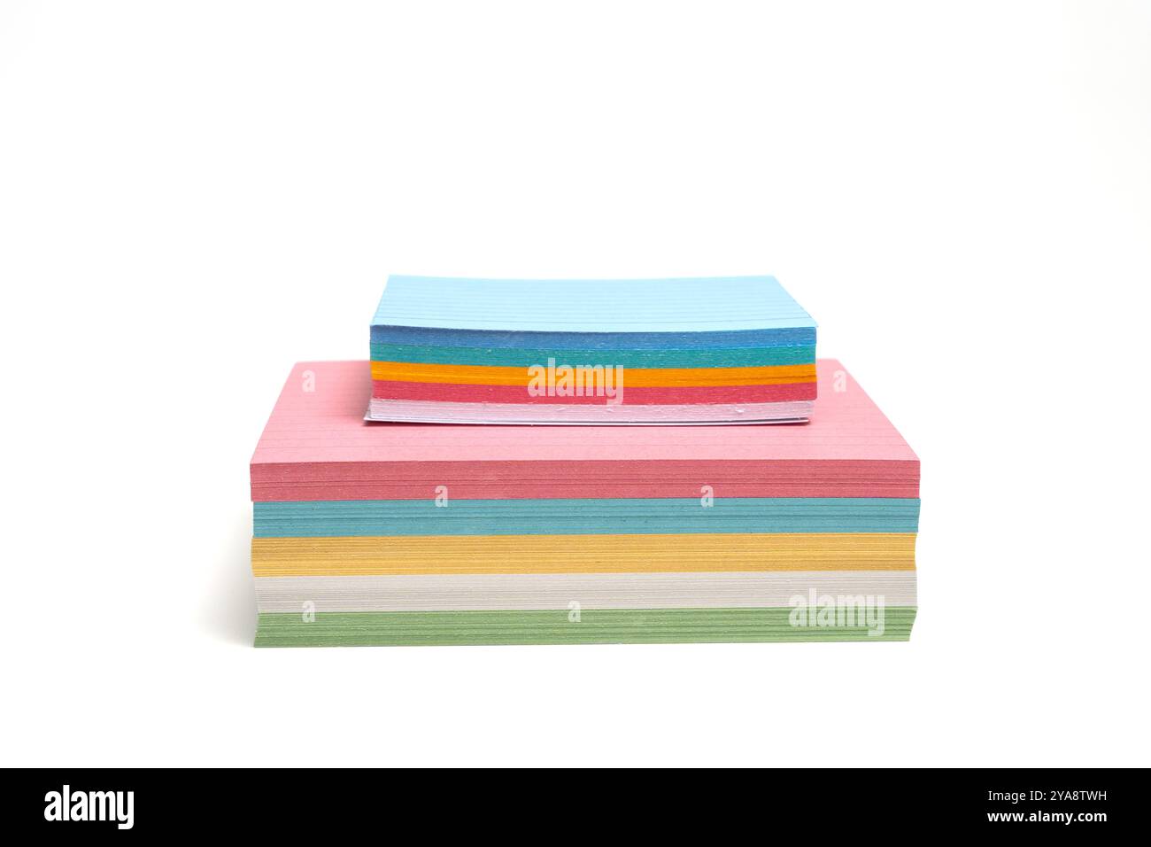 Two stacks of colored paper stacked on top of each other. The paper is ...