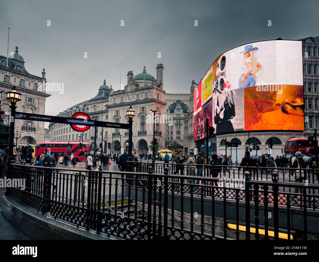 Piccadilly Circus, Underground sign, digital billboards, busy street ...