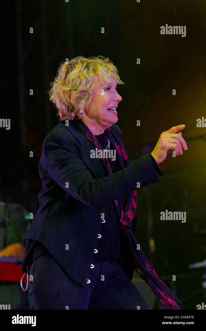 Despite the rain Marjo performs on the main stage of Olympic park's ...