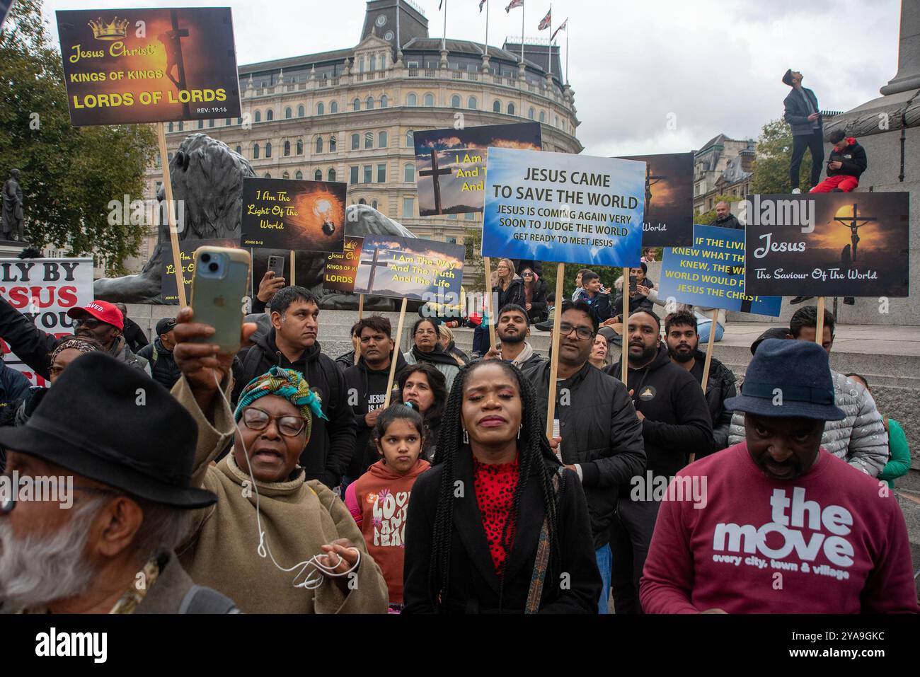 London, UK. 12th Oct, 2024. Worshippers stand with placards during the ...