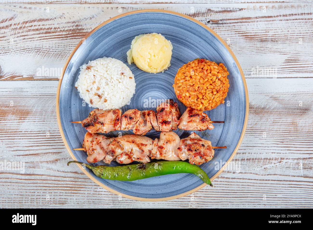 Grilled chicken on bamboo skewers. Chicken garbage skewer grill. Shish ...