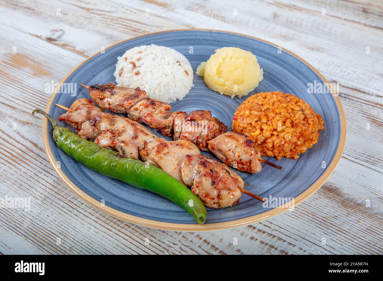 Grilled chicken on bamboo skewers. Chicken garbage skewer grill. Shish ...
