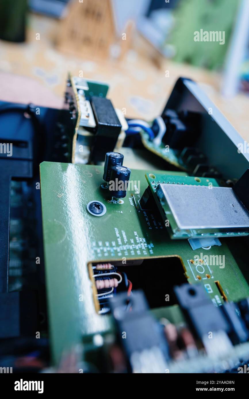 Detailed view of an optical drive with electronic components and wiring ...