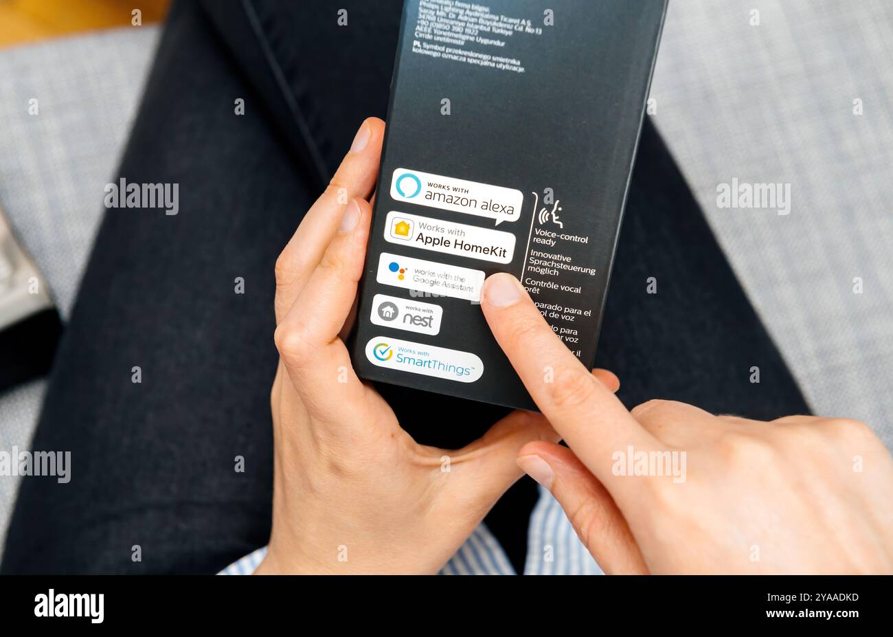Paris, France - Aug 16, 2024: A woman holds the Philips Hue Bridge for ...
