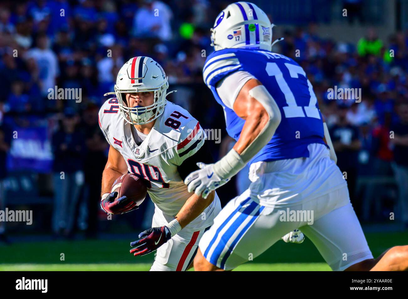 Arizona tight end Sam Olson, left, catches a pass for a first down but ...