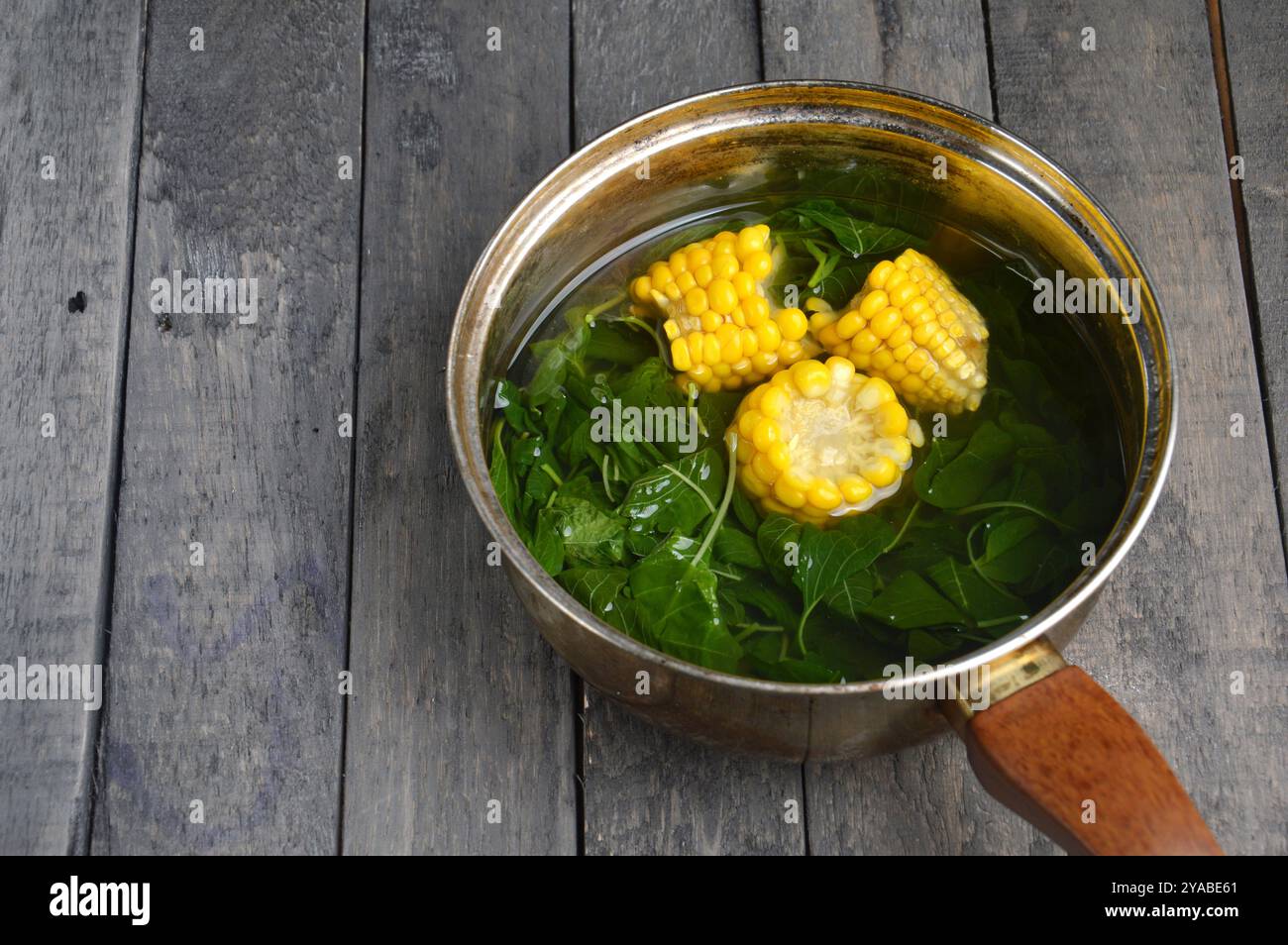 vegetable spinach cook with corn in a pan on a board table Stock Photo ...
