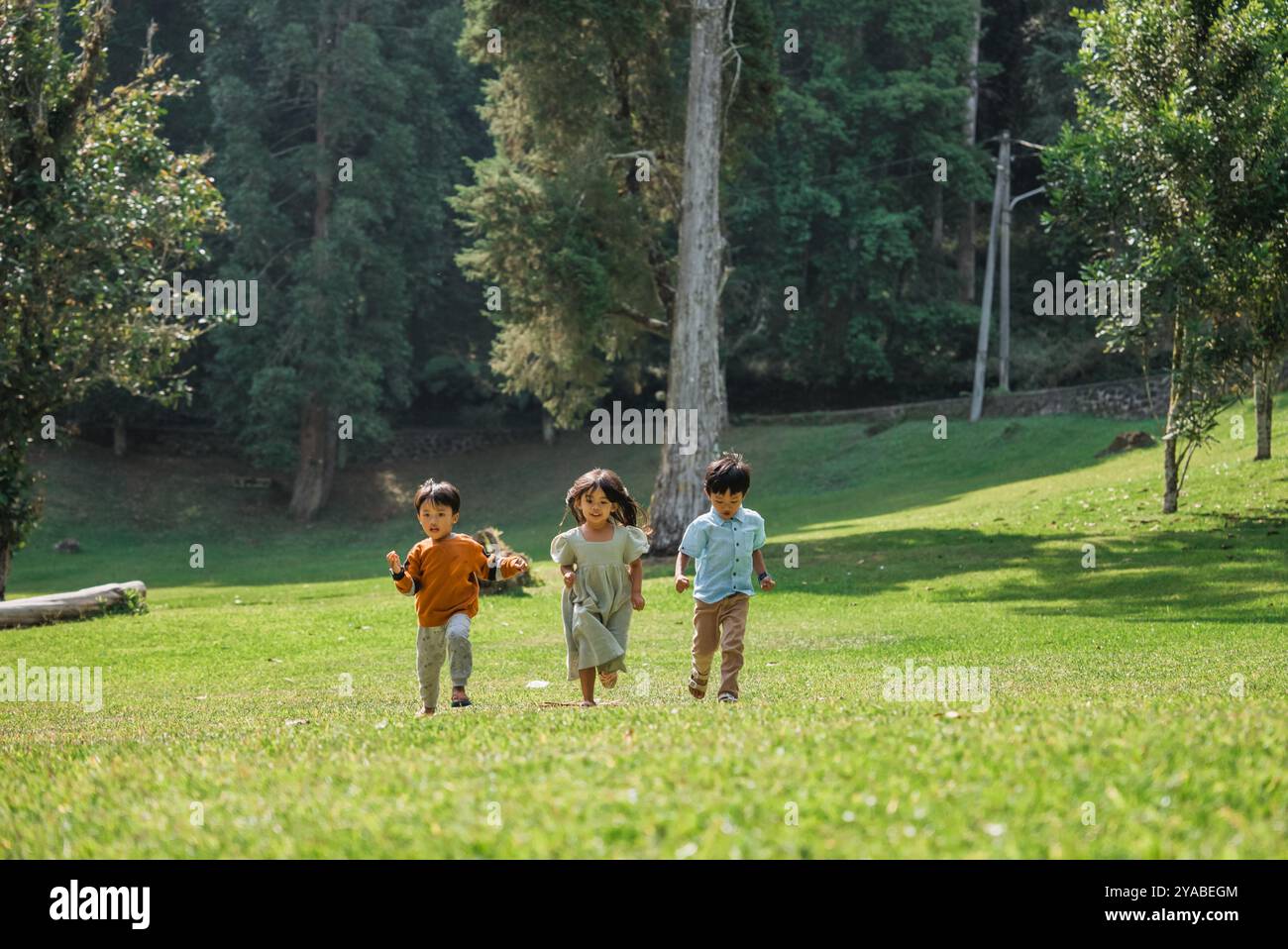 Children joyfully running hi-res stock photography and images - Alamy