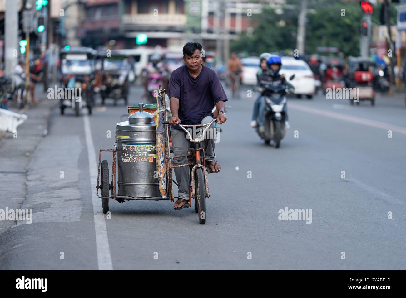 A traditional Filipino mobile ice cream vendor using a pedal cycle ...