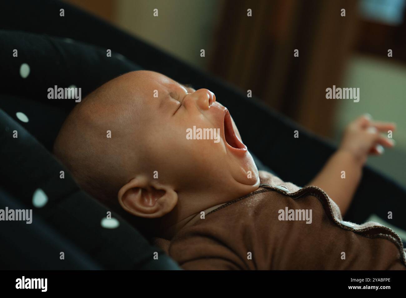 An Adorable Baby Yawning with a Cherubic Innocent Expression Displayed ...