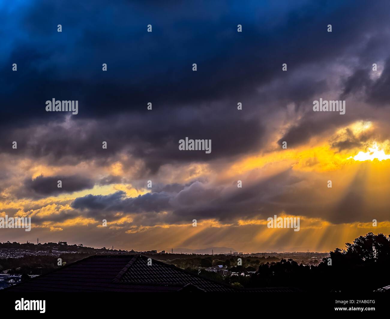 A view of high-ground hills in Auckland lays of sunlights on the ...