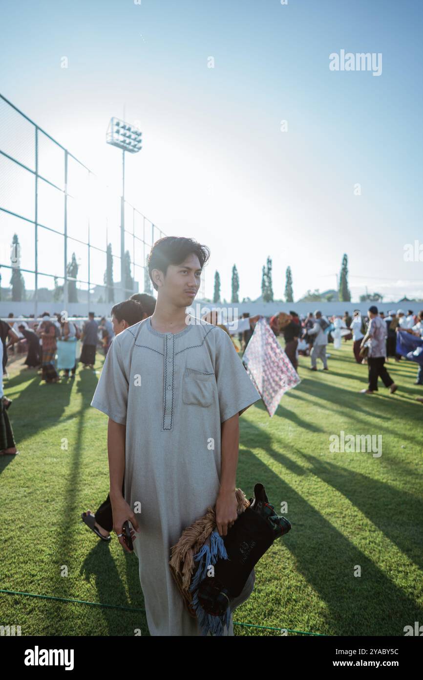 A group of youth dressed in traditional garb at an outdoor event under ...
