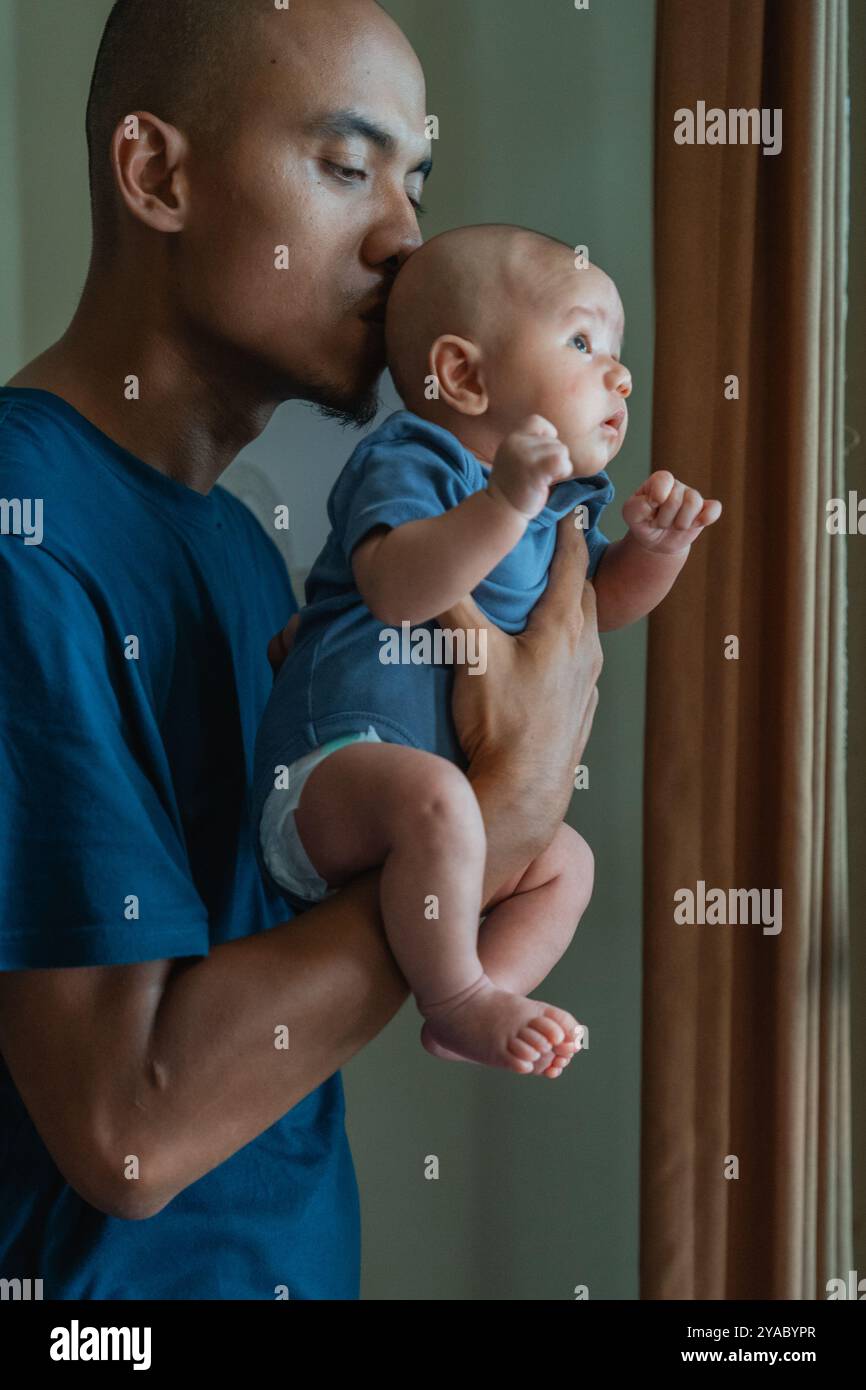 Father and Baby Together by the Window A Beautiful, Tender Moment of ...