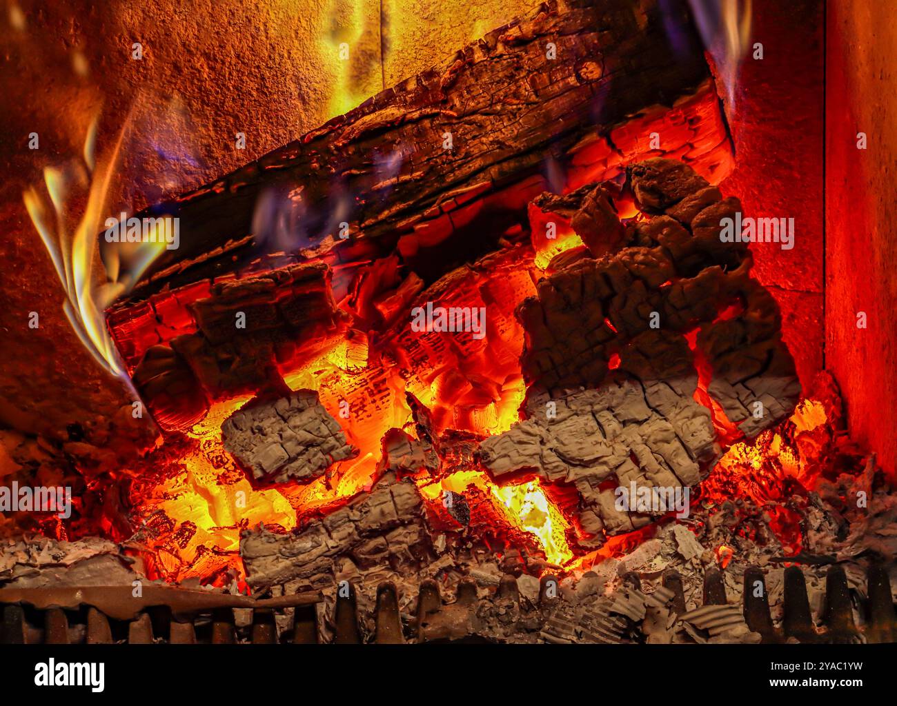 Big logs are burning in the stove Stock Photo - Alamy