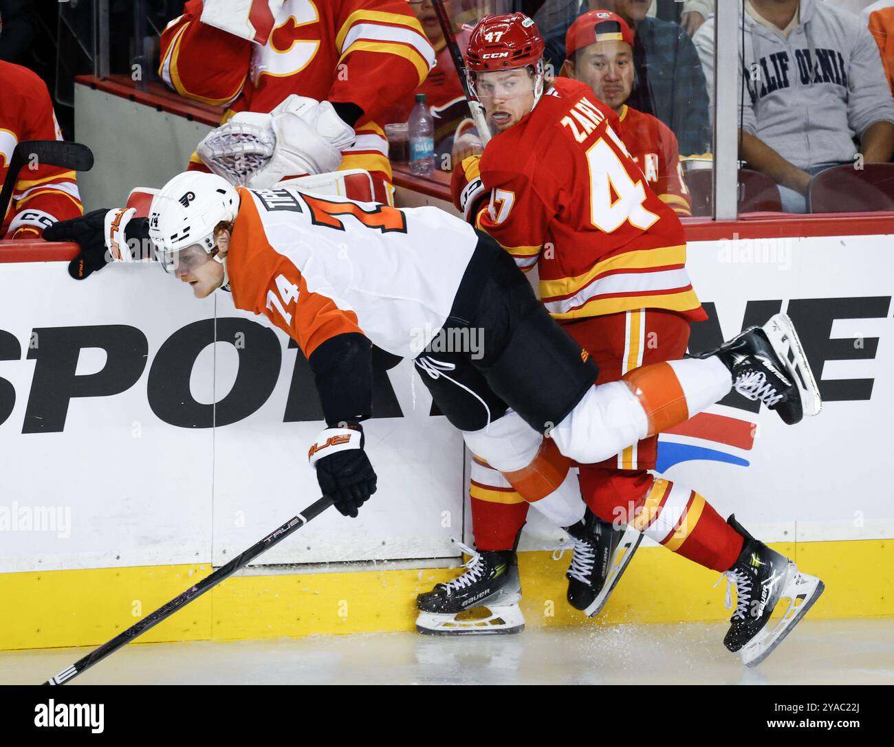 Philadelphia Flyers' Owen Tippett, left, checks Calgary Flames' Connor ...