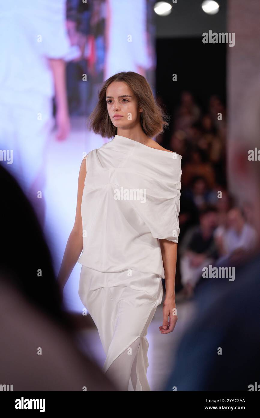 A model walks the runway during Ricardo Andrez fashion show at ...
