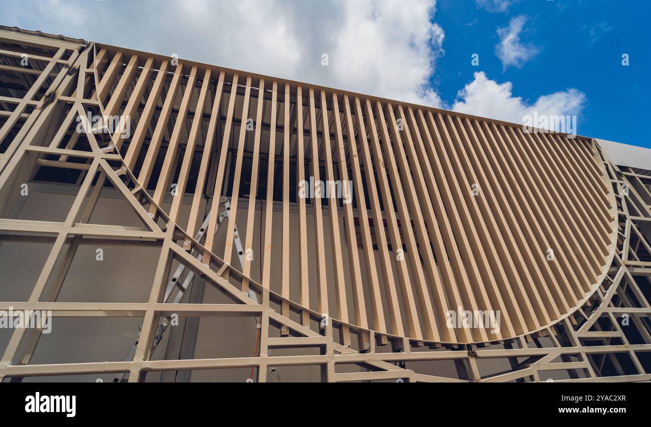 A structure featuring wooden slats on construction site contributing to ...