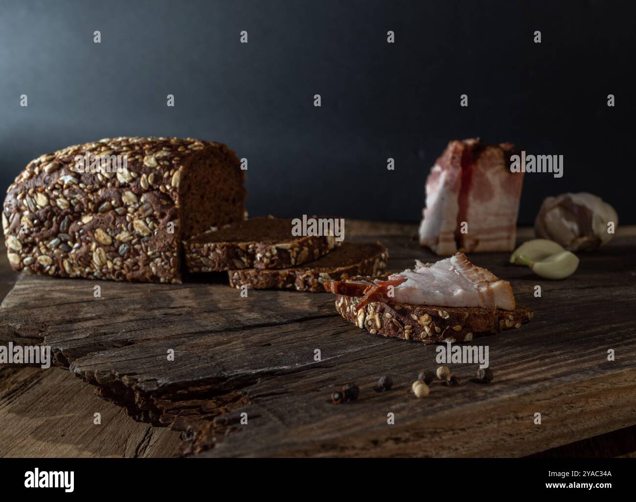 Dark unleavened bread. Dark bread with grains and seeds. Making a ...