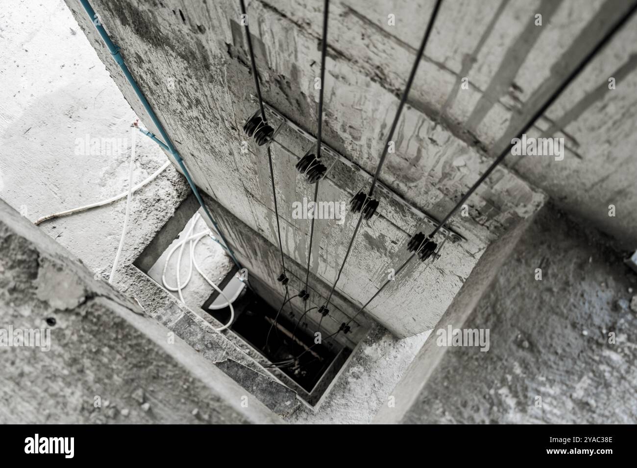 Cables in an elevator shaft at a new building construction site Stock ...