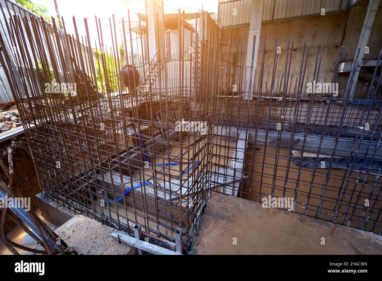 A construction site displaying a reinforced concrete foundation with ...