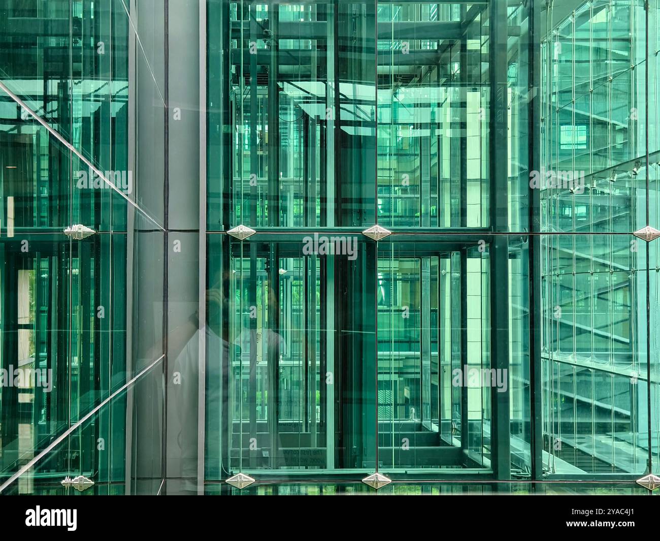 A modern tall building that features a significant amount of glass ...