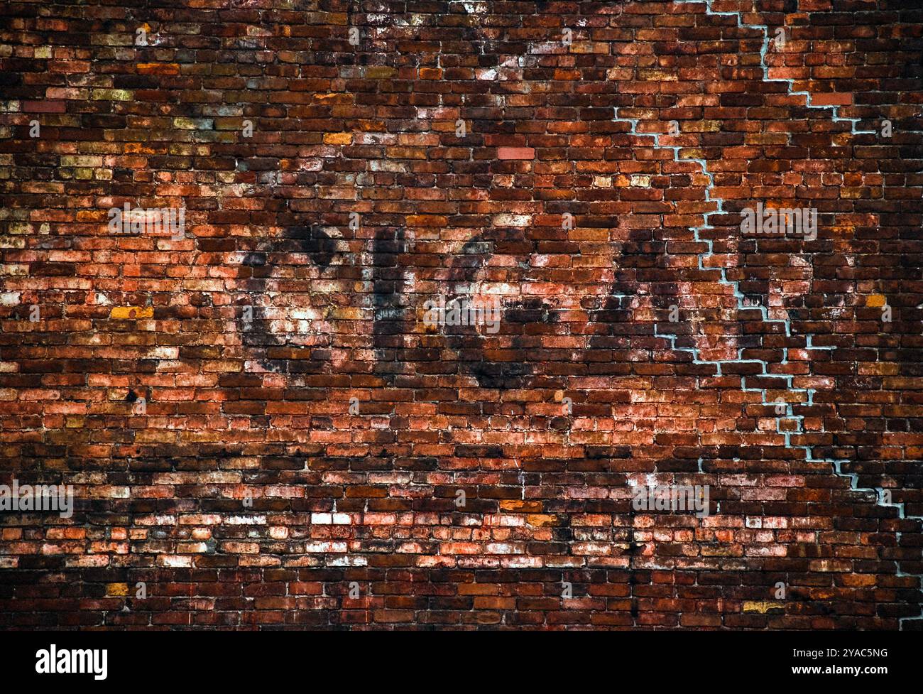 Photography of urban art on a brick wall with cigar font text Stock ...