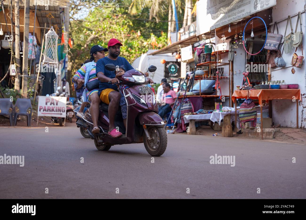 GOA, India - February 23, 2024: An Indian family rides a motorbike on ...