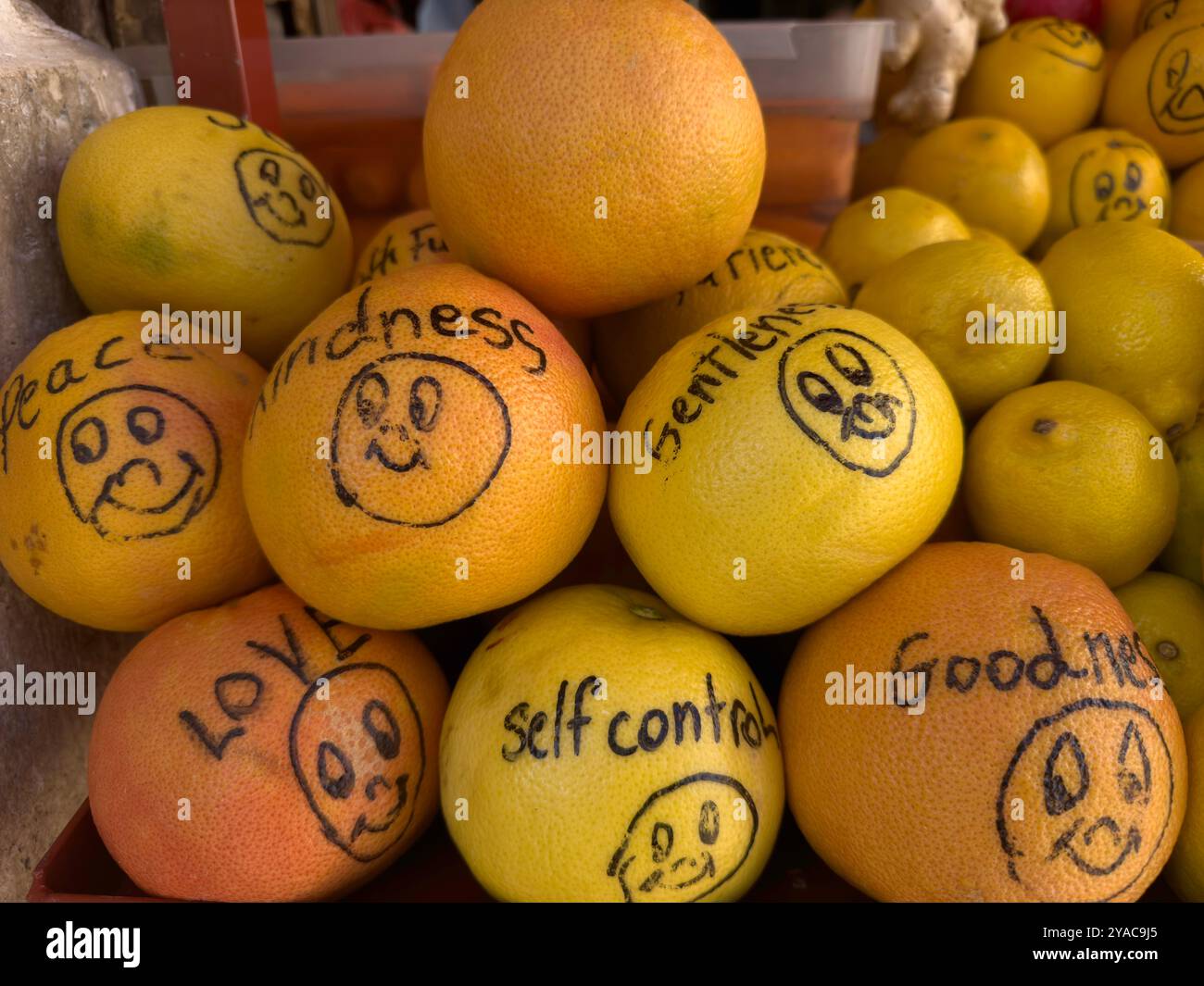 Stack of oranges with smiley faces and all kind of good vibes quotes in ...