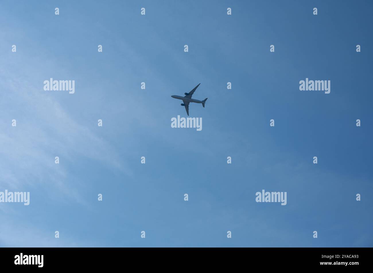 An airplane from below with a lot of sky Stock Photo - Alamy