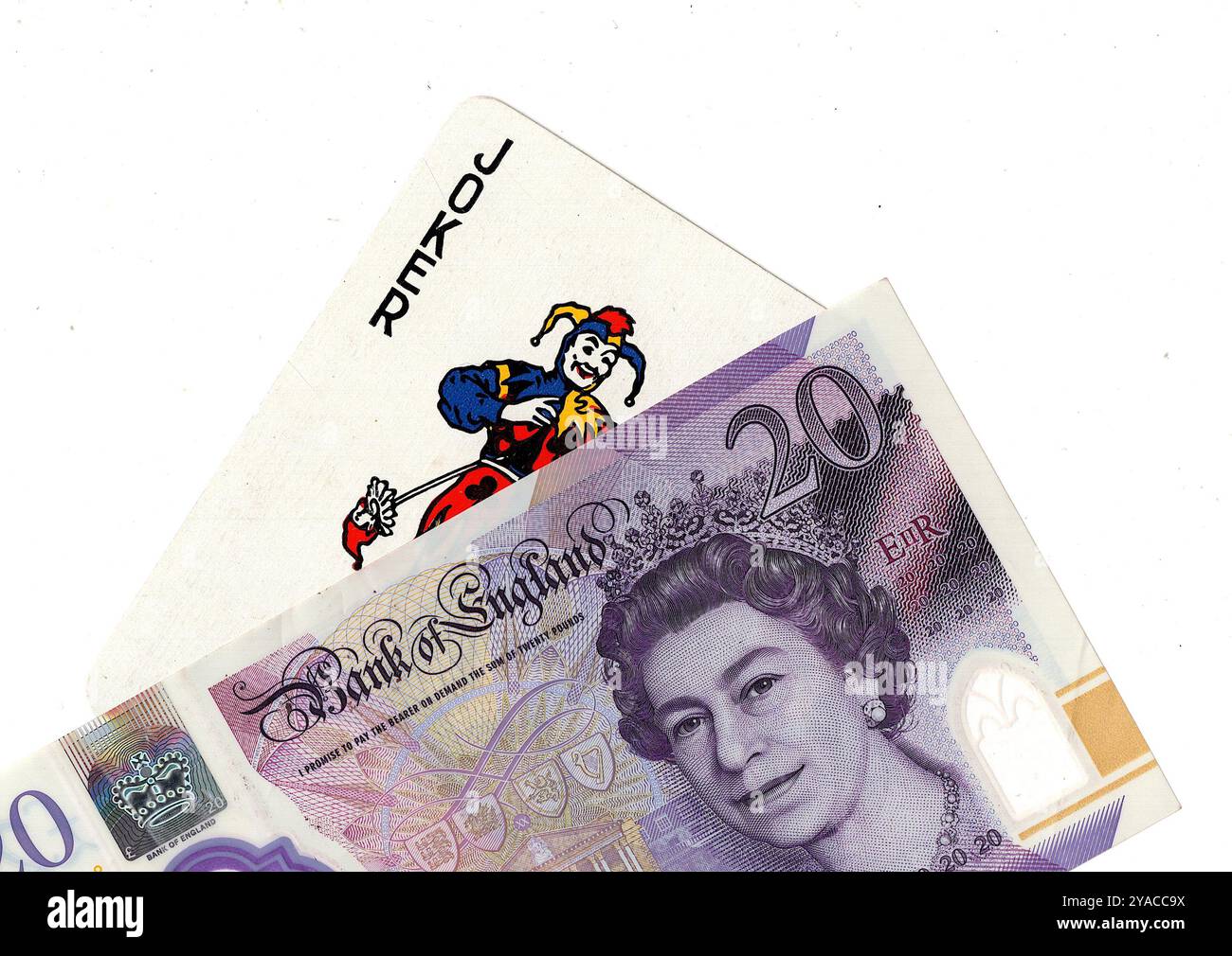 A joker playing card and a twenty pound banknote from the United ...